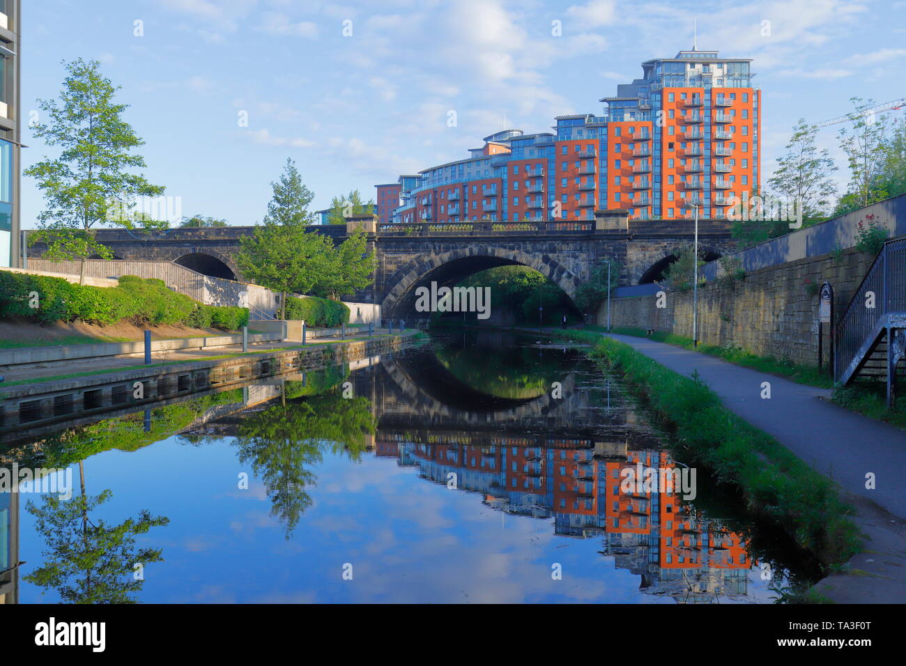 City Island apartment block , reflecting in the Leeds to Liverpool ...