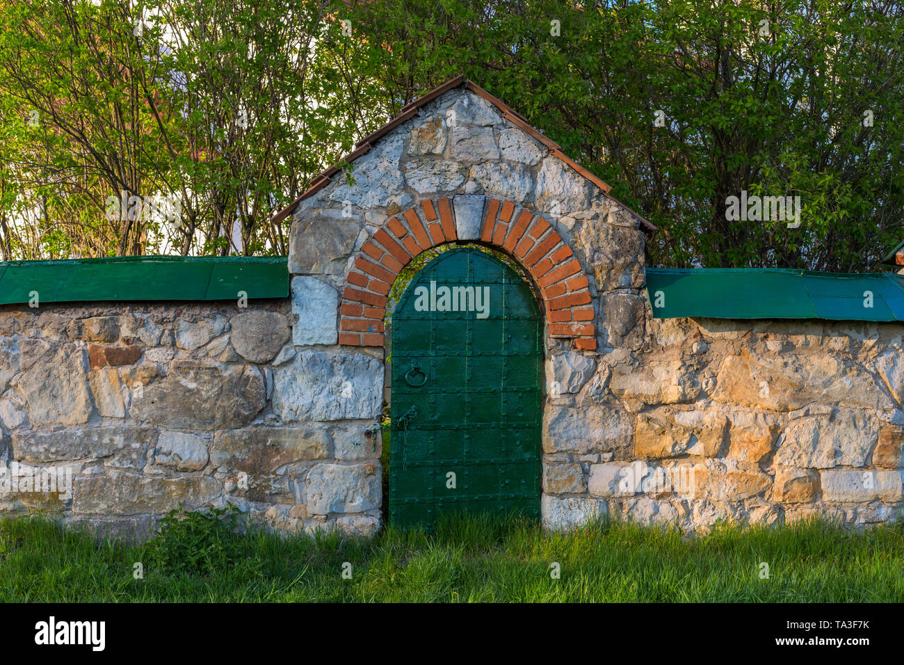 limestone fence with iron riveted wicket Stock Photo - Alamy