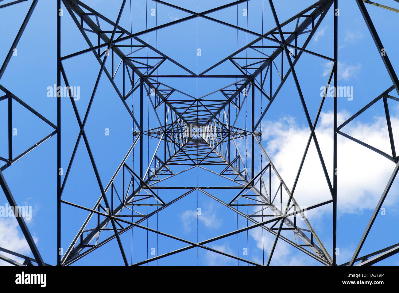 Abstract pattern effect looking up directly beneath an electricity ...