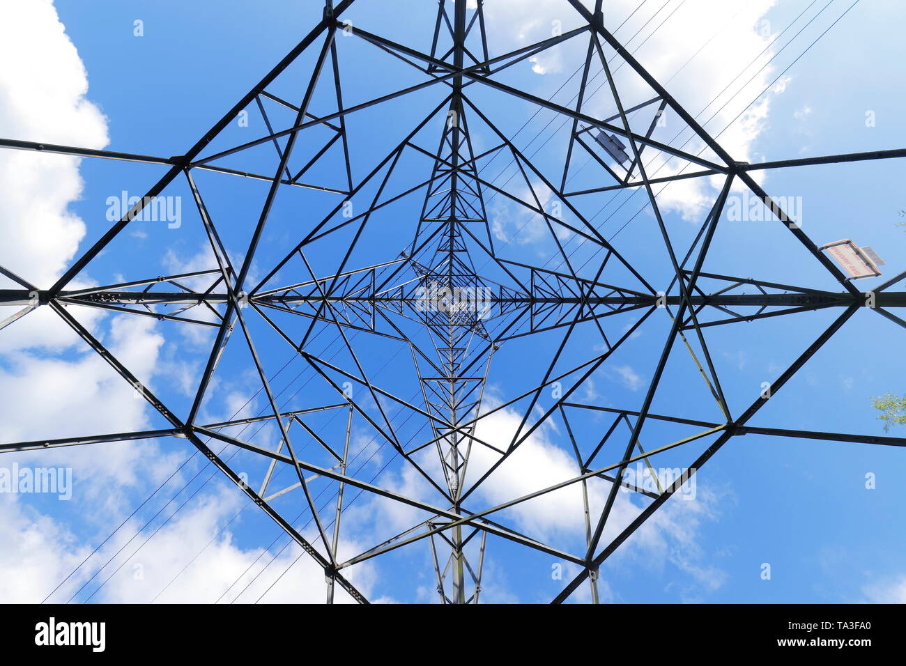 Abstract pattern effect looking up directly beneath an electricity ...