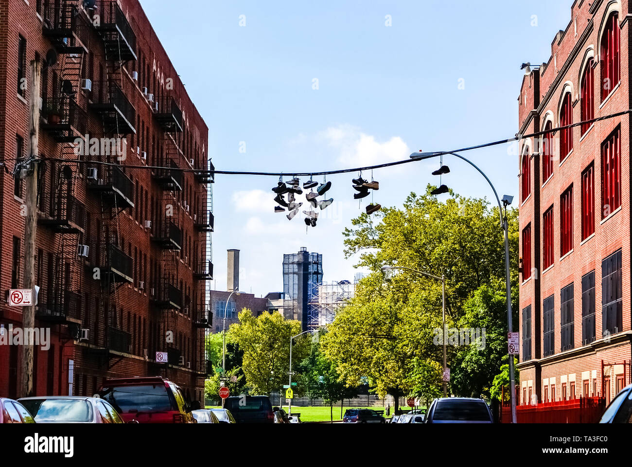 Pairs shoes hang from telephone hi-res stock photography and images - Alamy