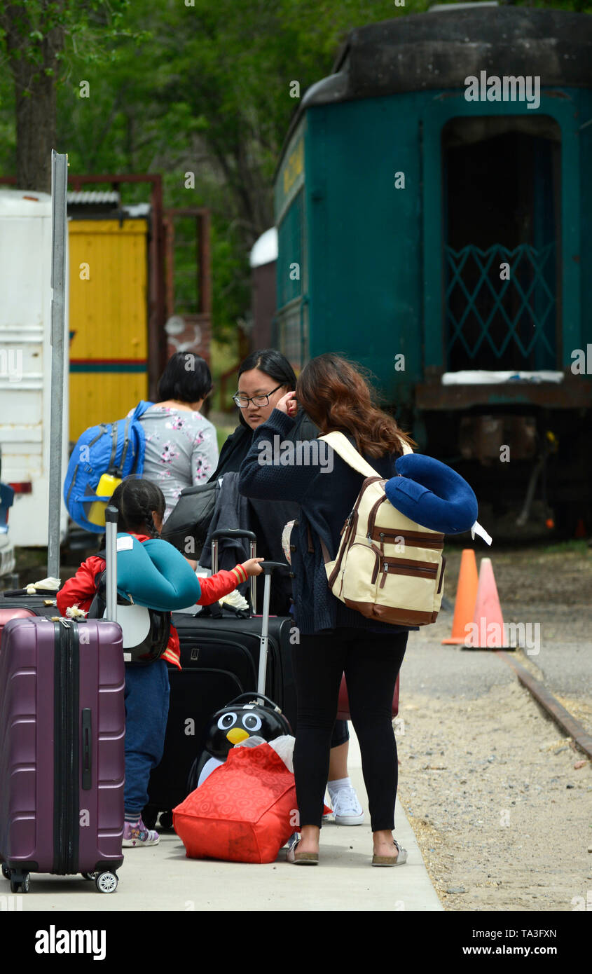 Railroad passengers prepare to board an Amtrak train at the historic ...
