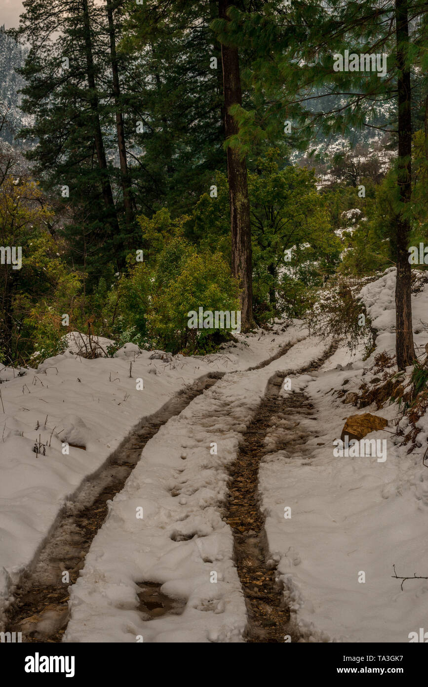 Snow covered road in mountains - Majestic winter landscape in himalayas ...