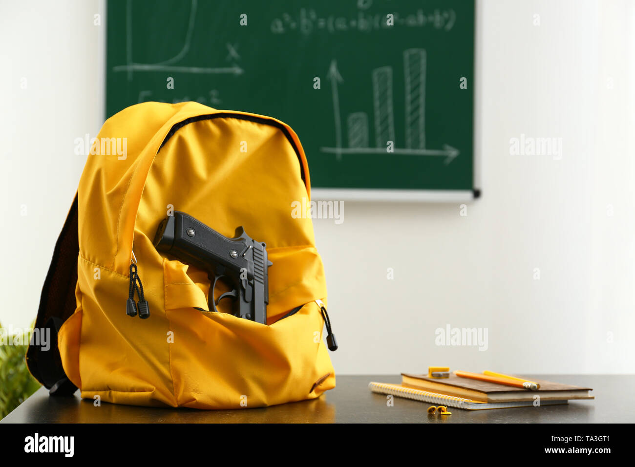 Schoolbag with gun hi-res stock photography and images - Alamy