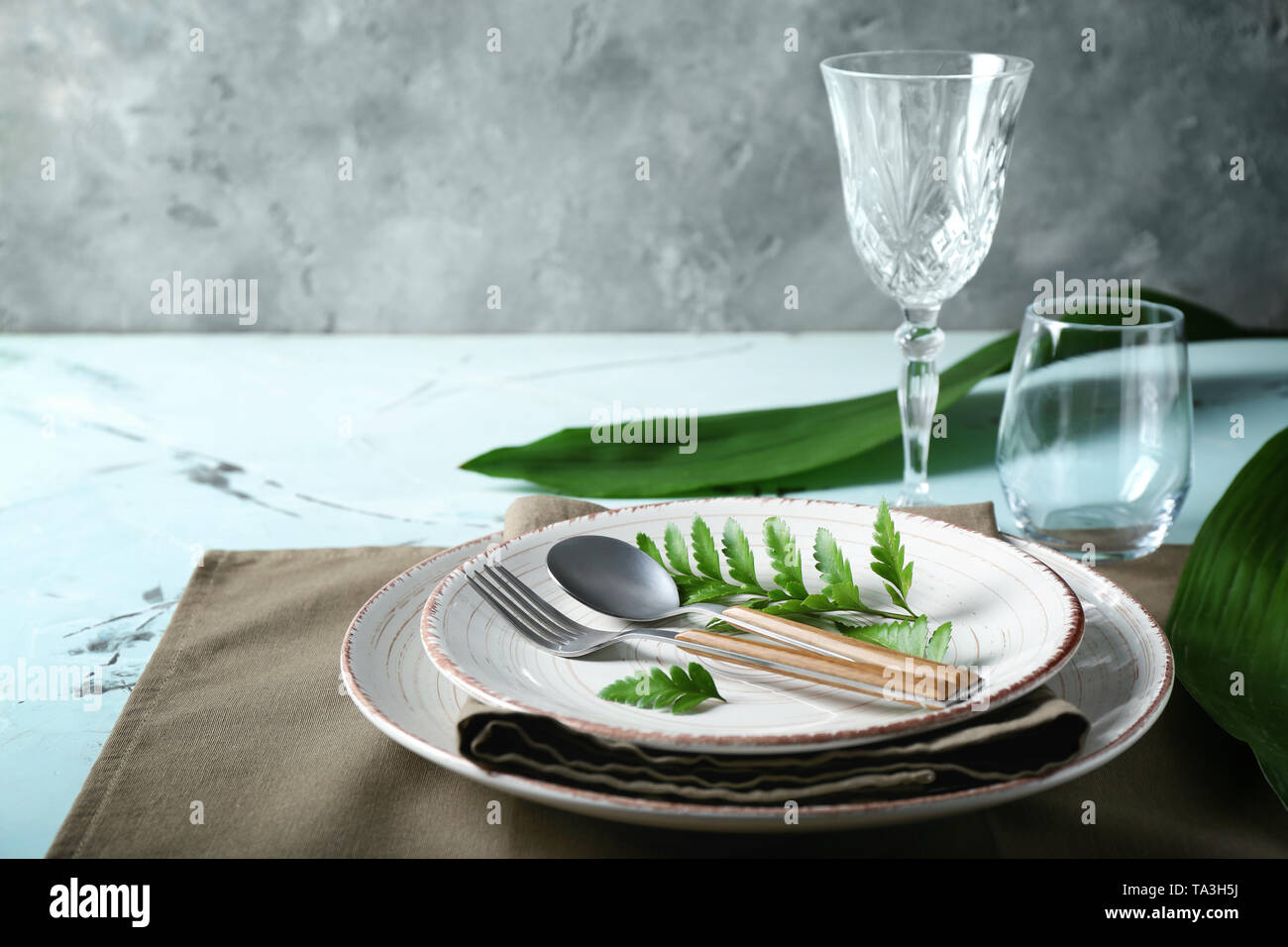 Simple table setting in restaurant Stock Photo - Alamy
