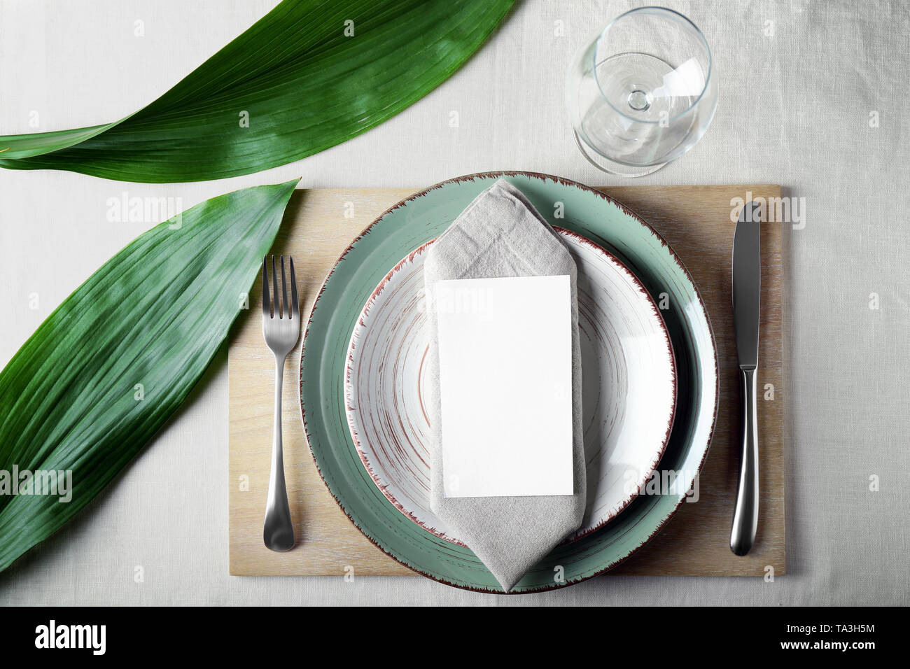 Simple table setting in restaurant Stock Photo - Alamy
