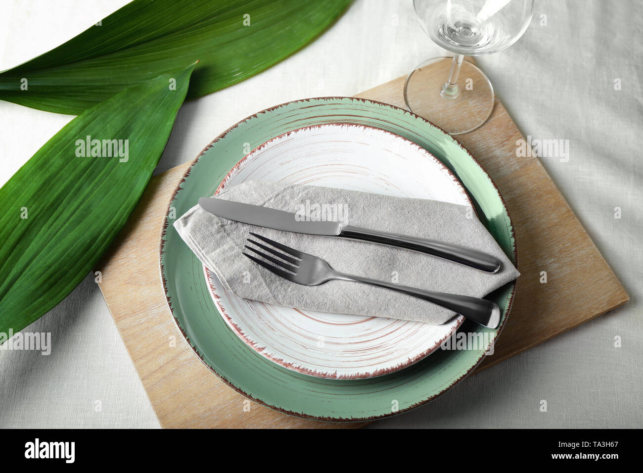 Simple table setting in restaurant Stock Photo - Alamy