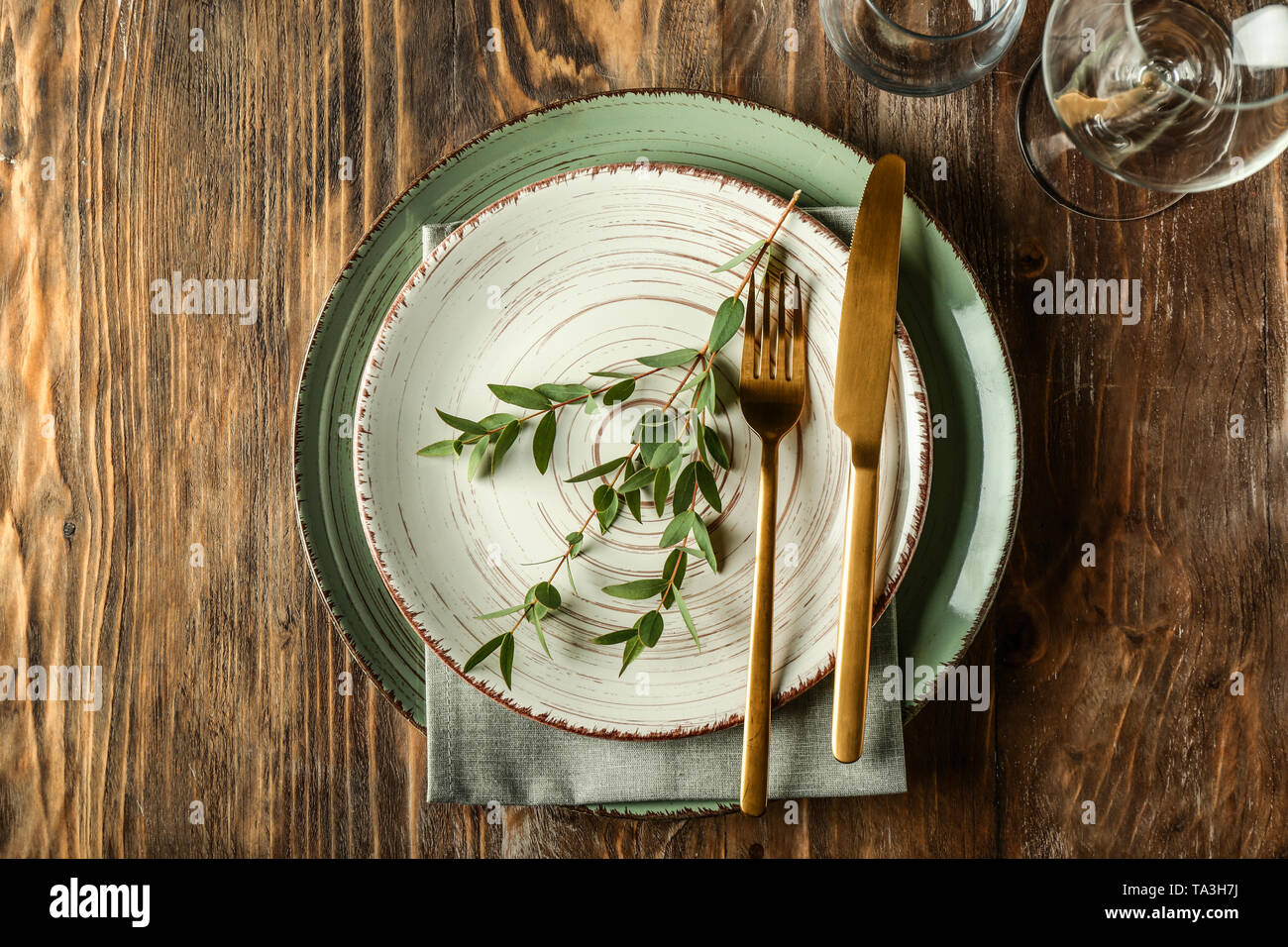 Simple table setting on wooden background Stock Photo - Alamy