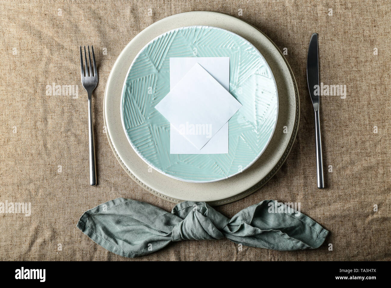 Simple table setting in restaurant Stock Photo - Alamy