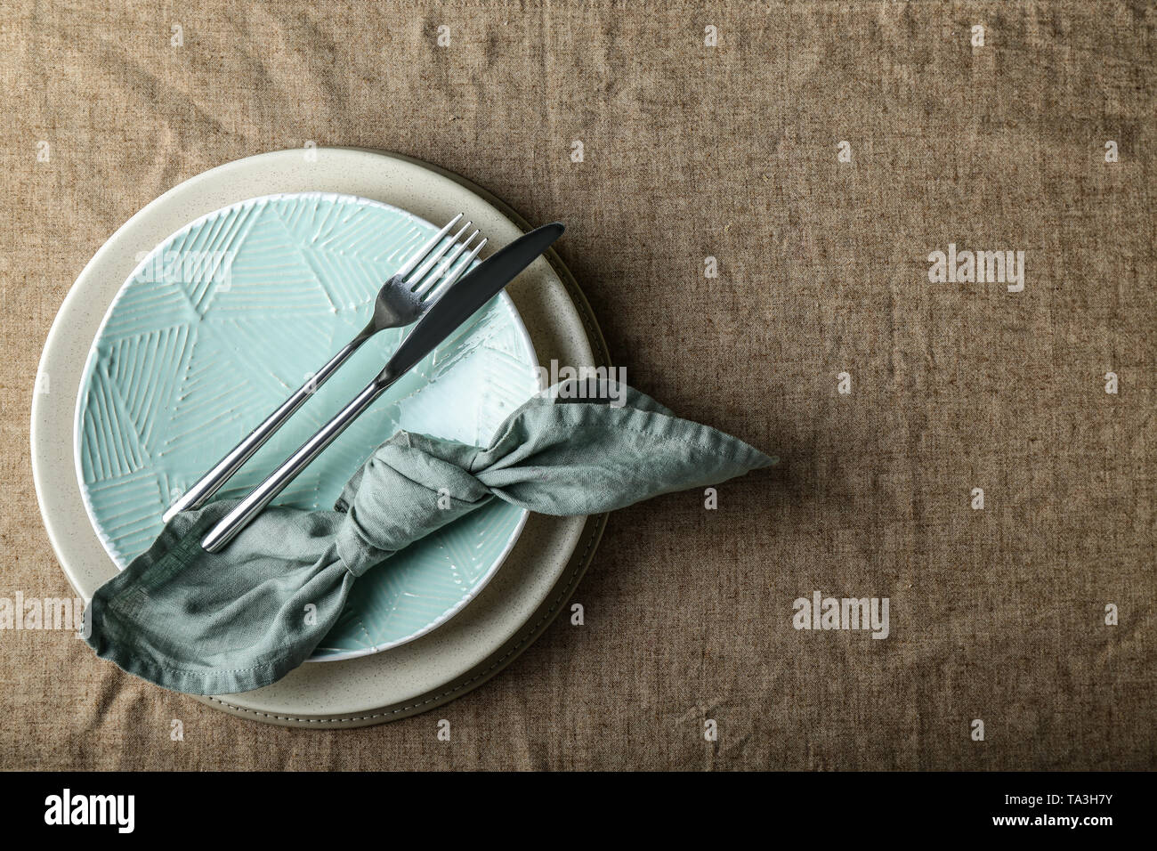 Simple table setting in restaurant Stock Photo - Alamy