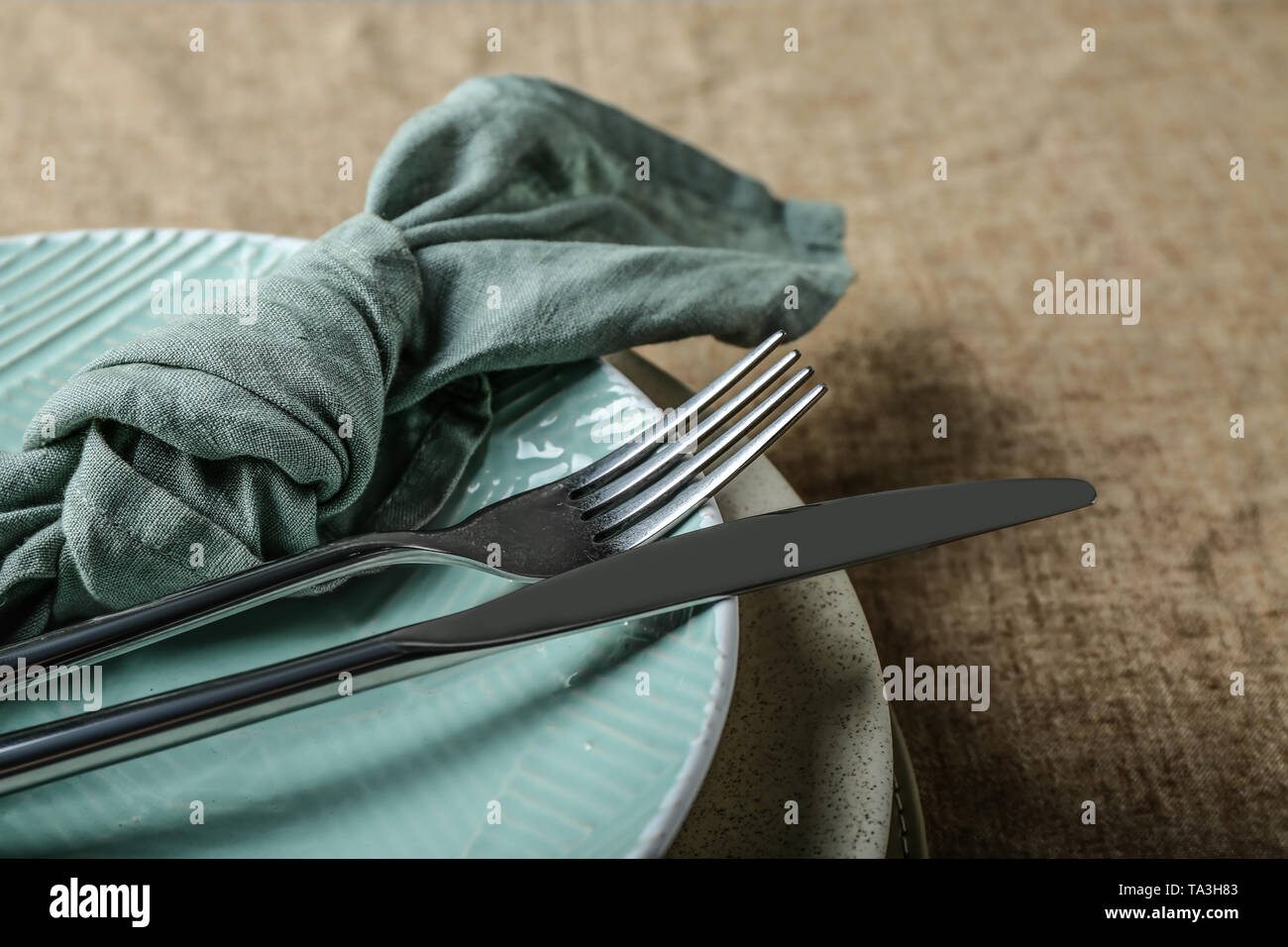 Simple table setting in restaurant Stock Photo - Alamy