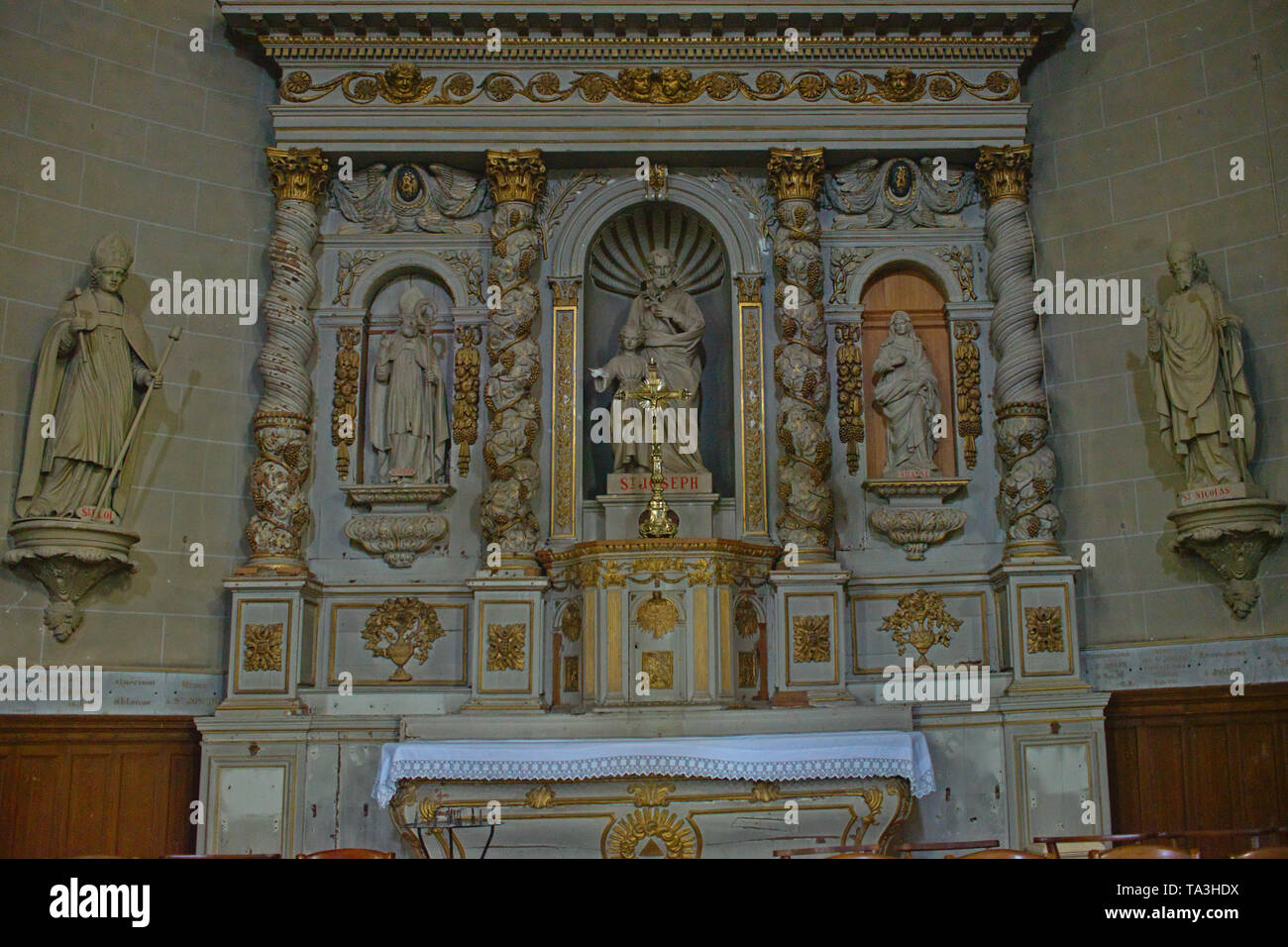 Altar with statues of saints in Catholic cathedral at Avranches, France ...