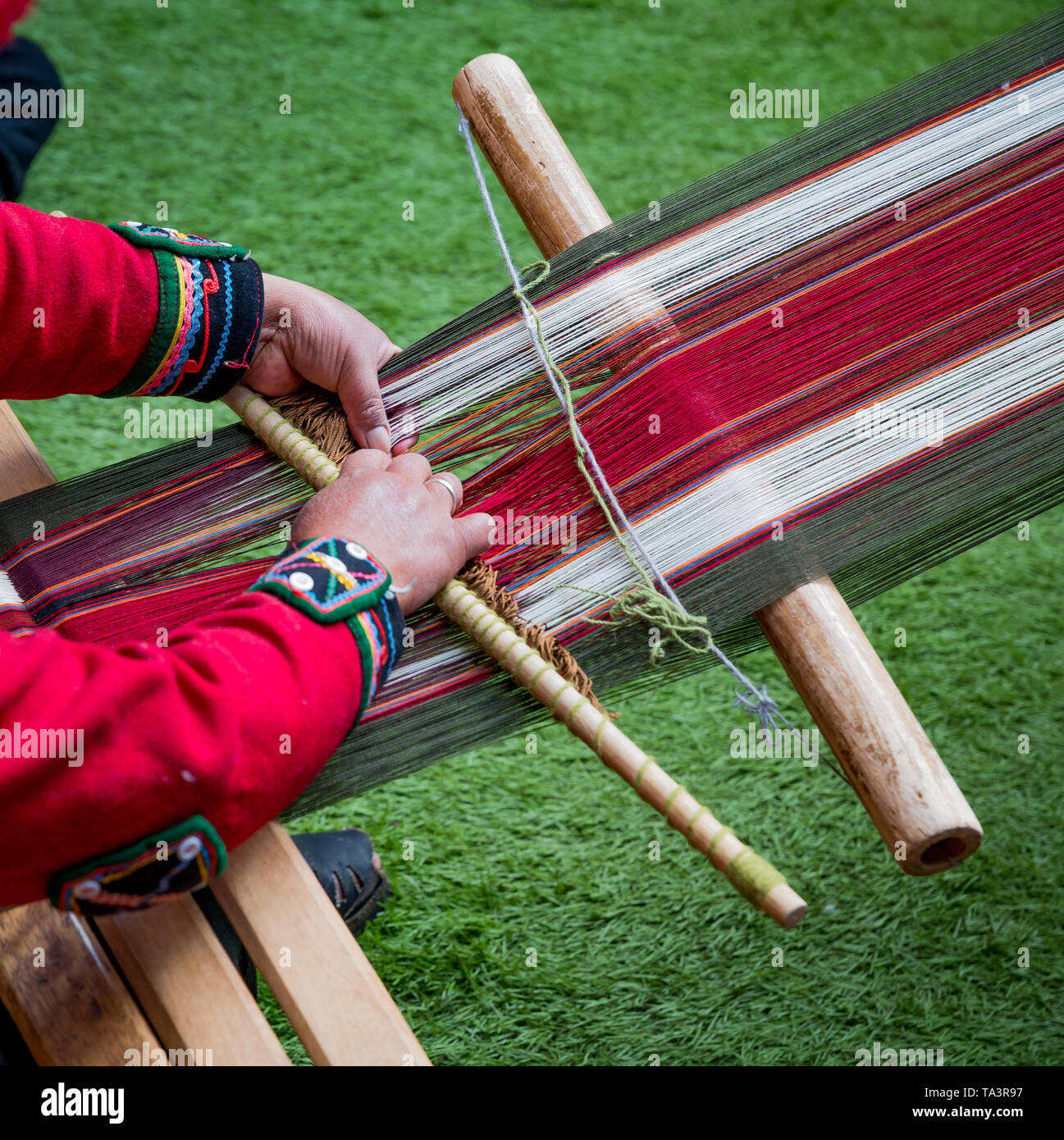 Chinchero, Peru woman weaving using traditional tools and wool Stock ...