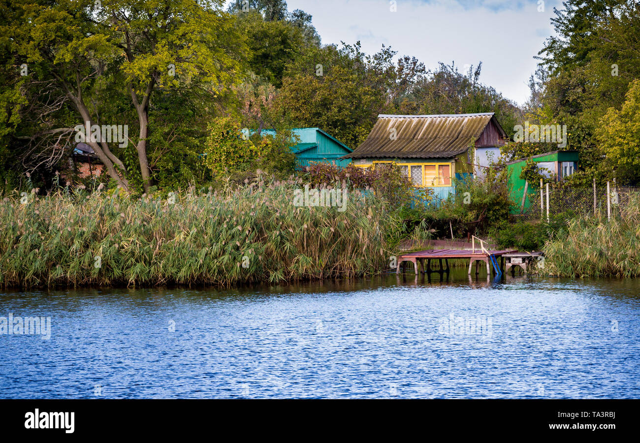 Colorful Ukrainian fishing hut along the river Stock Photo - Alamy
