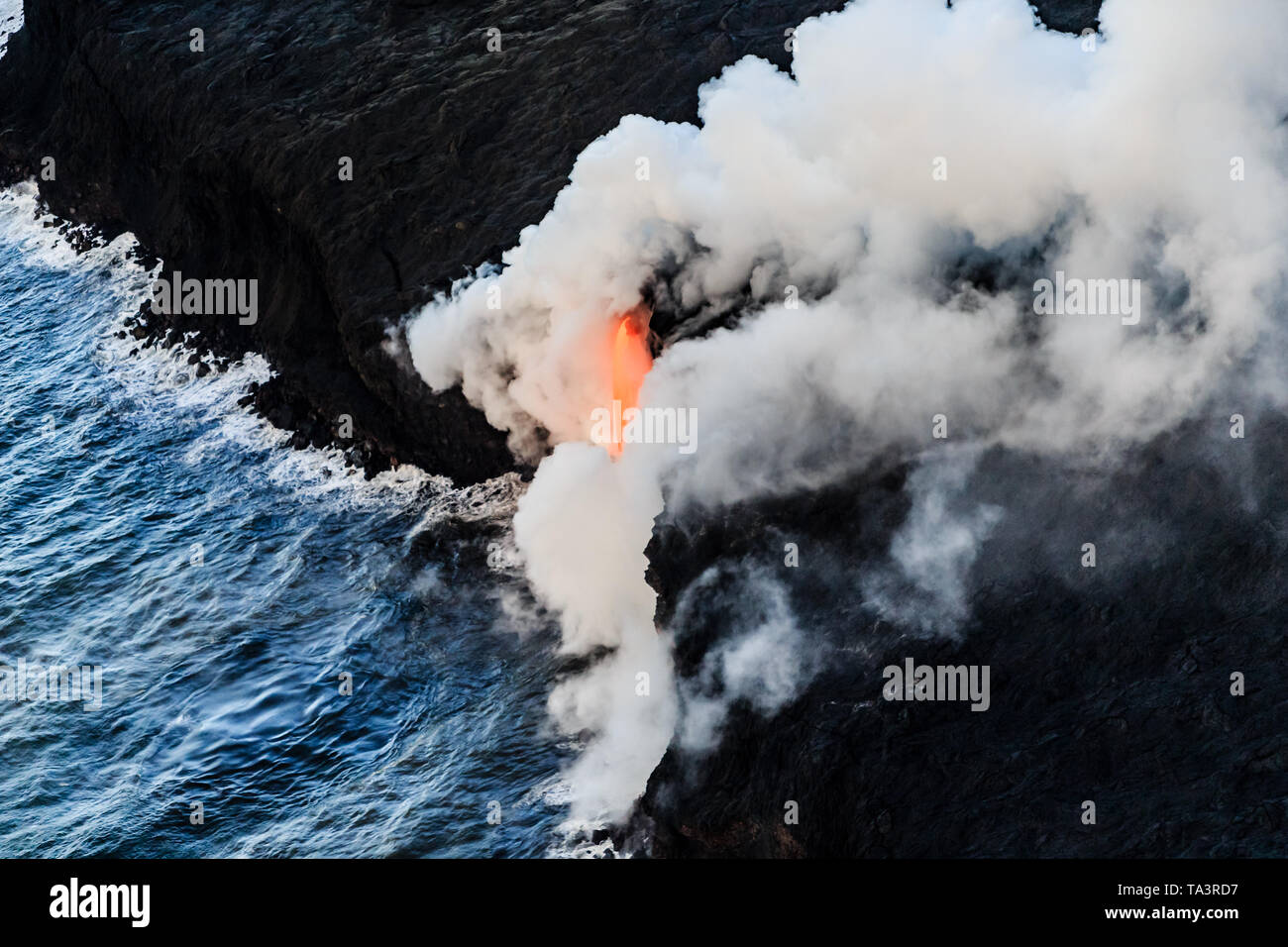 Hot lava flows into the ocean off Hawaii Stock Photo - Alamy