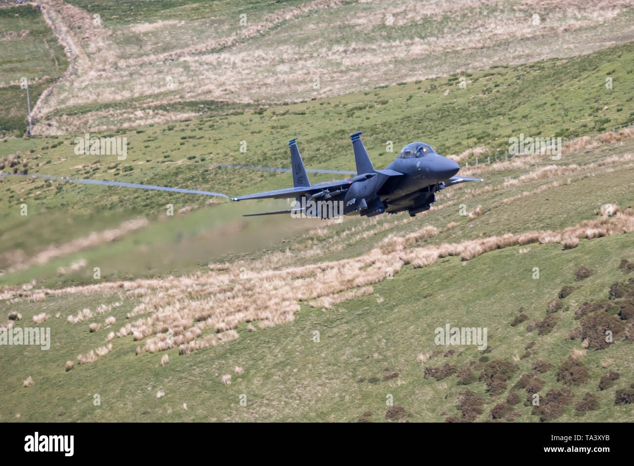 A USAF F-15 Strike Eagle passes through Mach Loop during low level ...