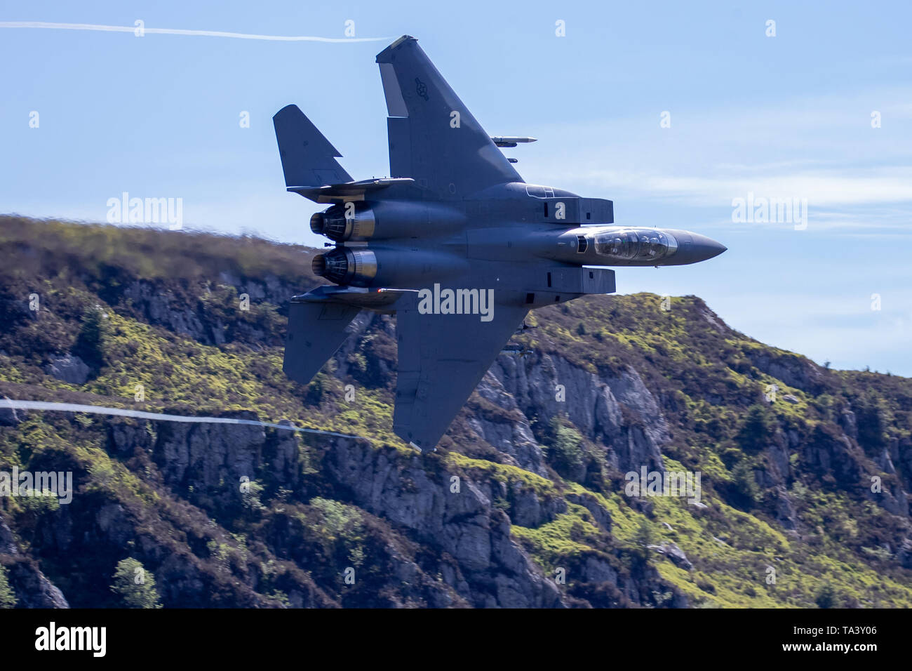 A USAF F-15 Strike Eagle passes through Mach Loop during low level ...