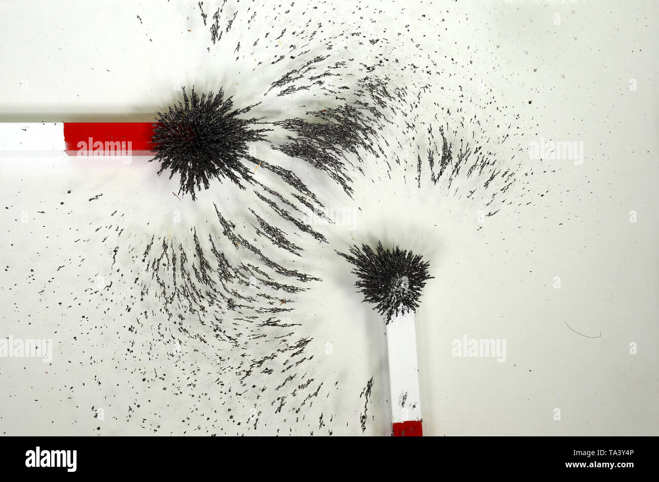 The lines of forces around two magnets with merging magnetic fields ...