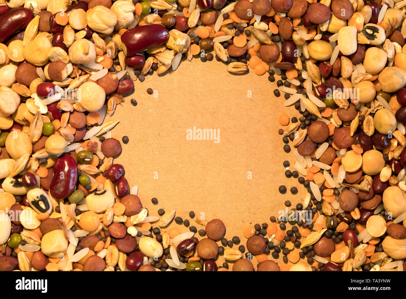 Various seed and pulses on a plain brown background Stock Photo - Alamy