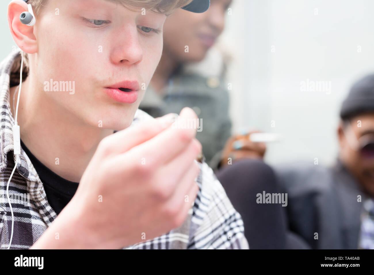 Teen boy smoking cigarette hi-res stock photography and images - Alamy