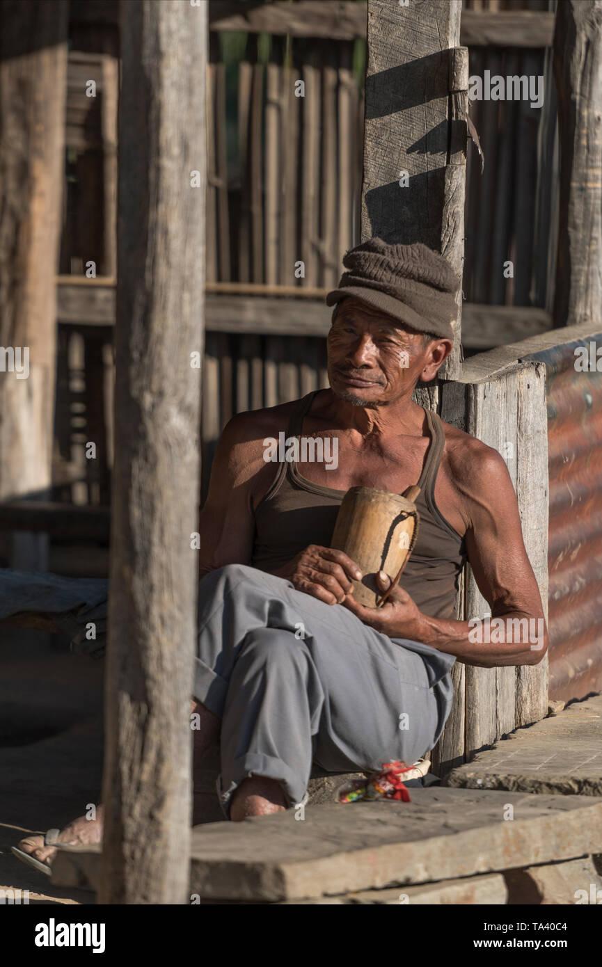 Old Naga Tribal Man enjoying his Rice Beer at Khonoma Village on 4th ...