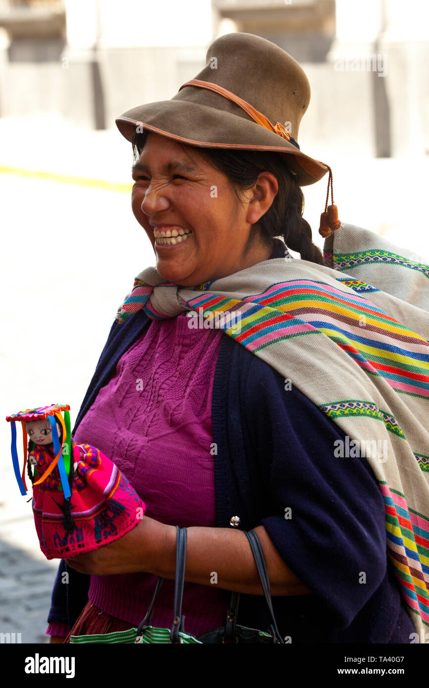 peruvian lady selling dolls Stock Photo - Alamy