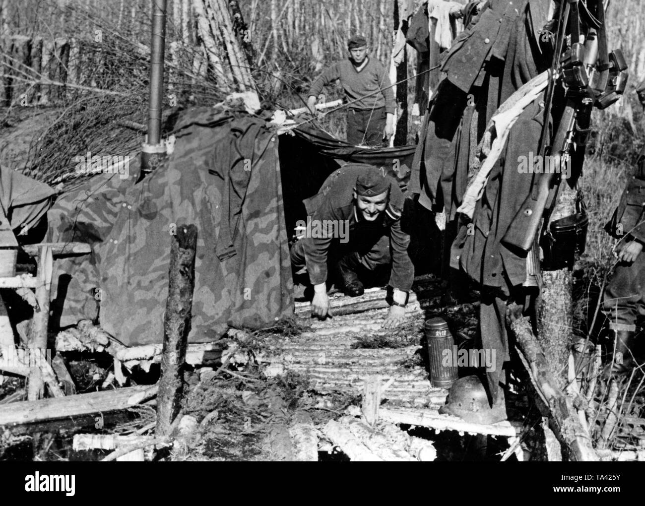 German soldiers in their emplacement in the marshy forests on the river ...
