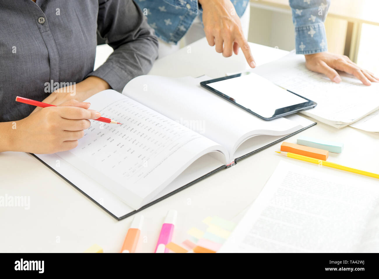 Two woman learn and teach tutor out of the class room concept education ...