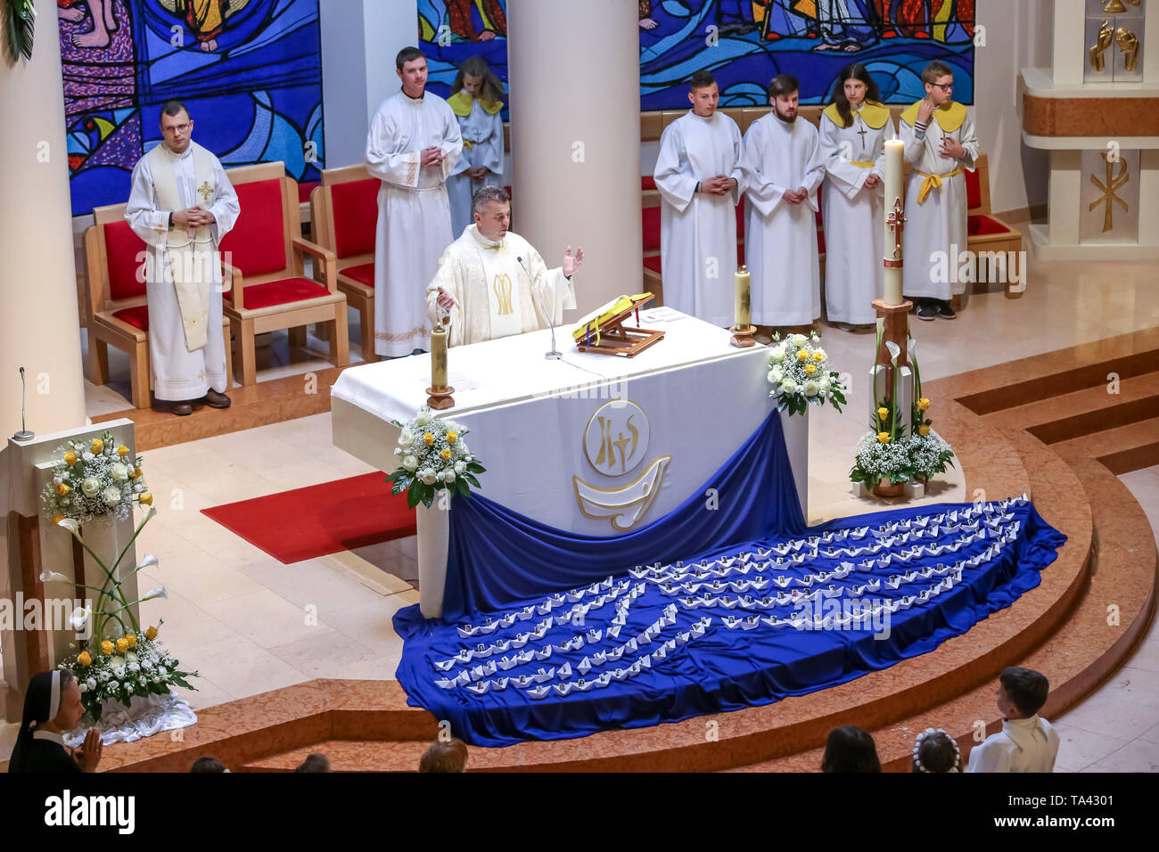 Zagreb, Croatia - May 5, 2019 : The priest on the altar holds the ...