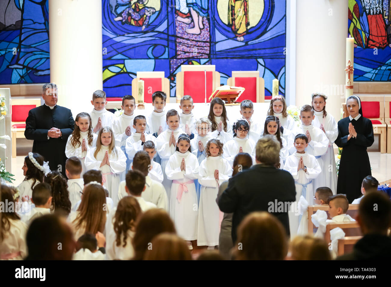 Catholic confirmation ceremony hi-res stock photography and images - Alamy