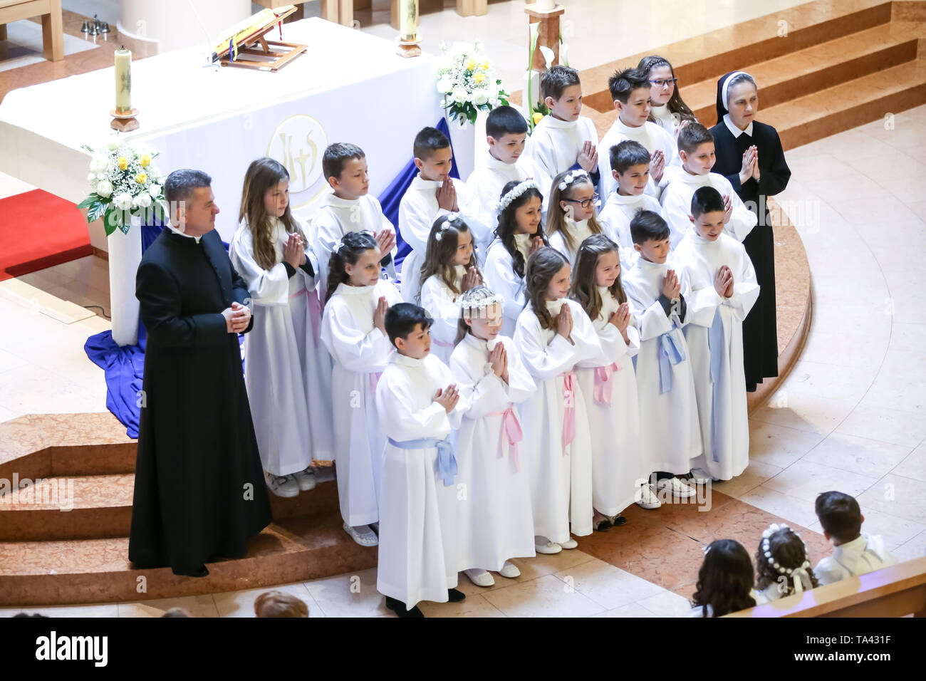 Catholic confirmation ceremony hi-res stock photography and images - Alamy