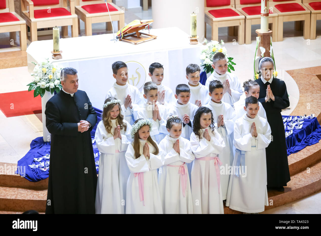 Catholic confirmation ceremony hi-res stock photography and images - Alamy