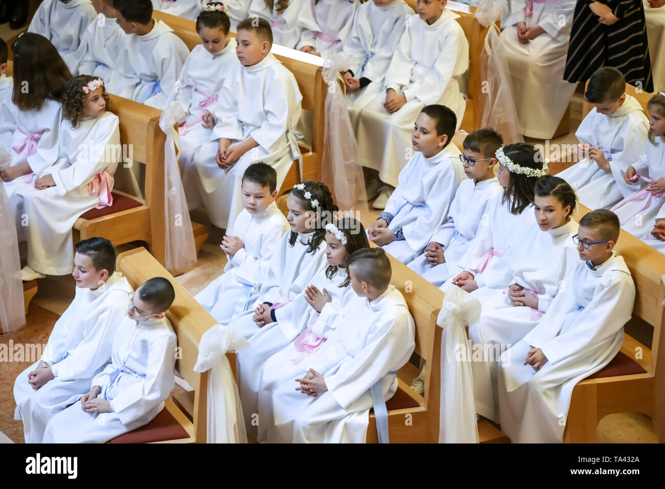 Group girls dressed for first communion hi-res stock photography and ...