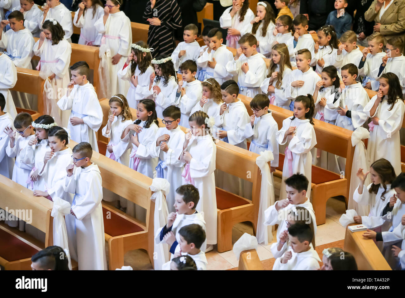 Group girls dressed for first communion hi-res stock photography and ...