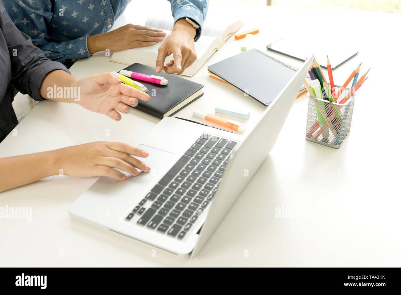 Two woman learn and teach tutor out of the class room concept education ...