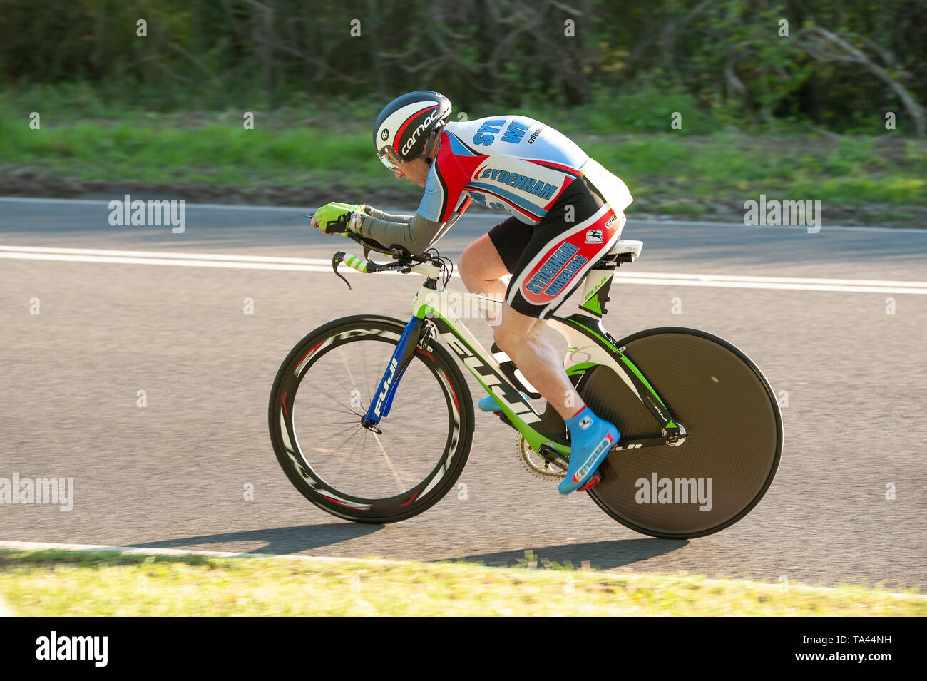 Racing in aero position in TT on time trial club event in summer ...