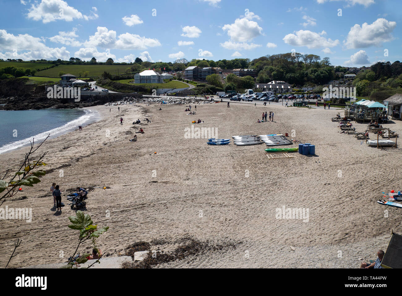 A warm and sunny day on Swanpool beach in Swanpool cove on the ...