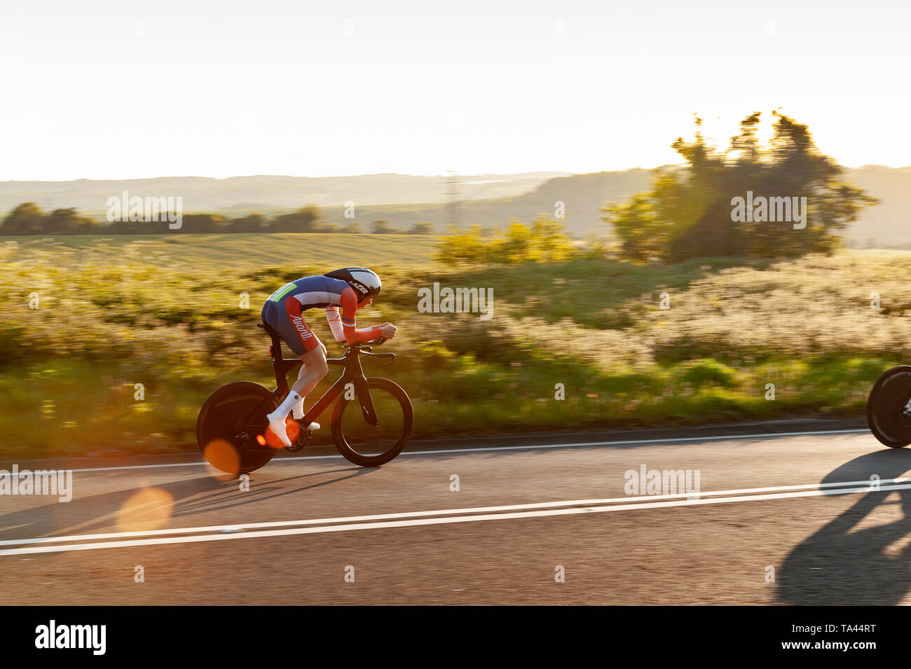 Racing in aero position in TT on time trial club event in summer ...