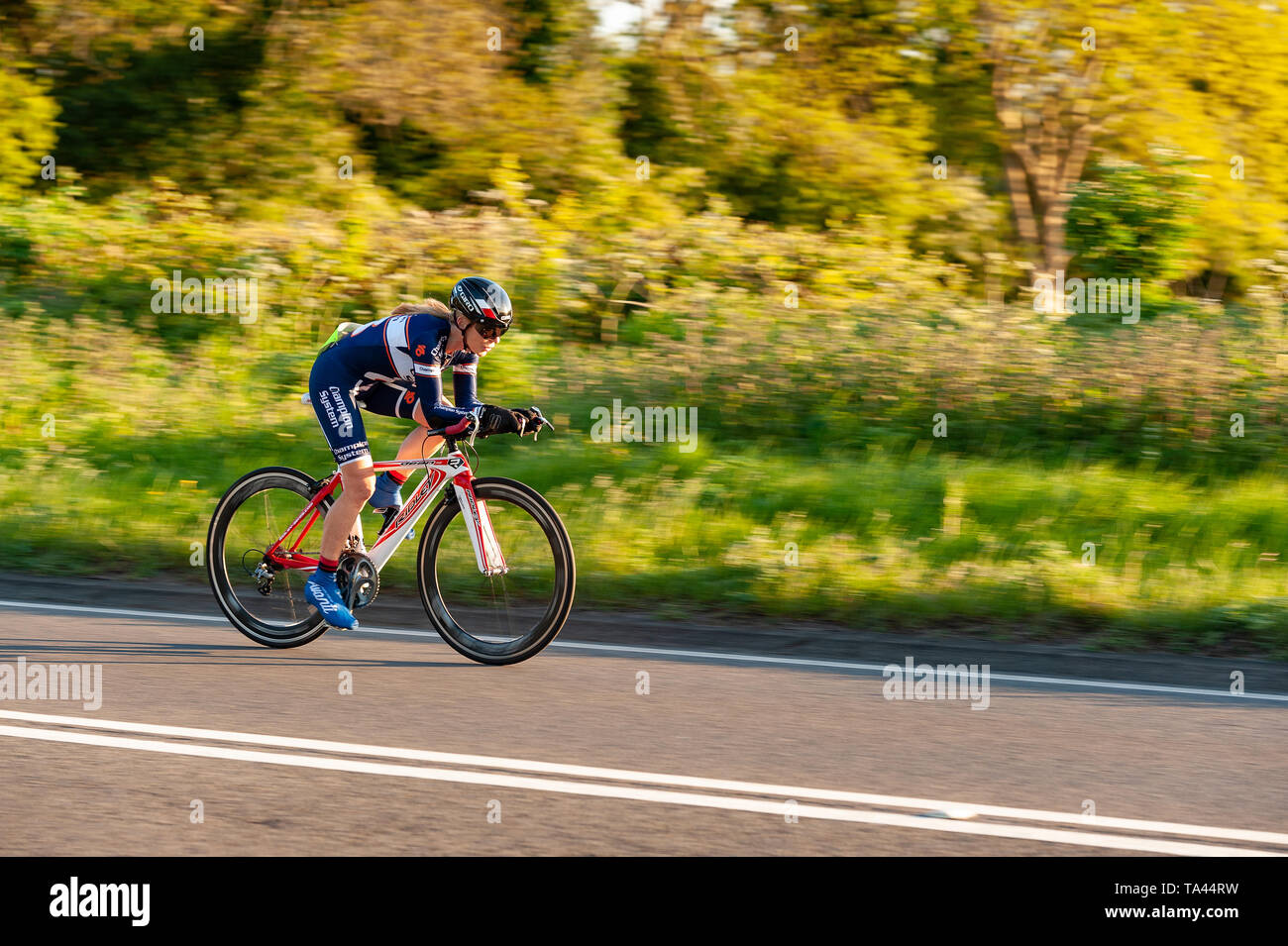 Racing in aero position in TT on time trial club event in summer ...