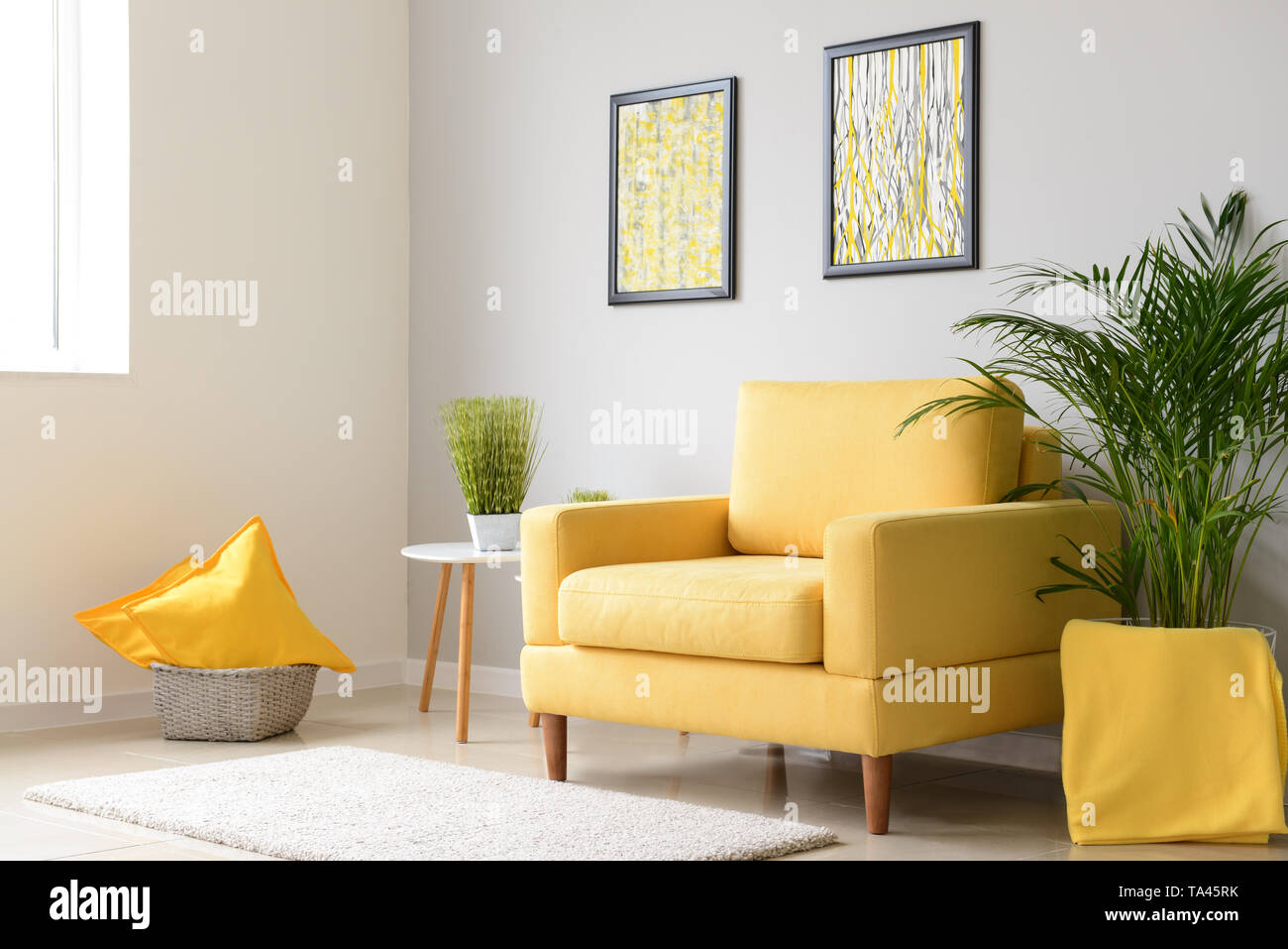 Interior of modern room with comfortable armchair Stock Photo - Alamy
