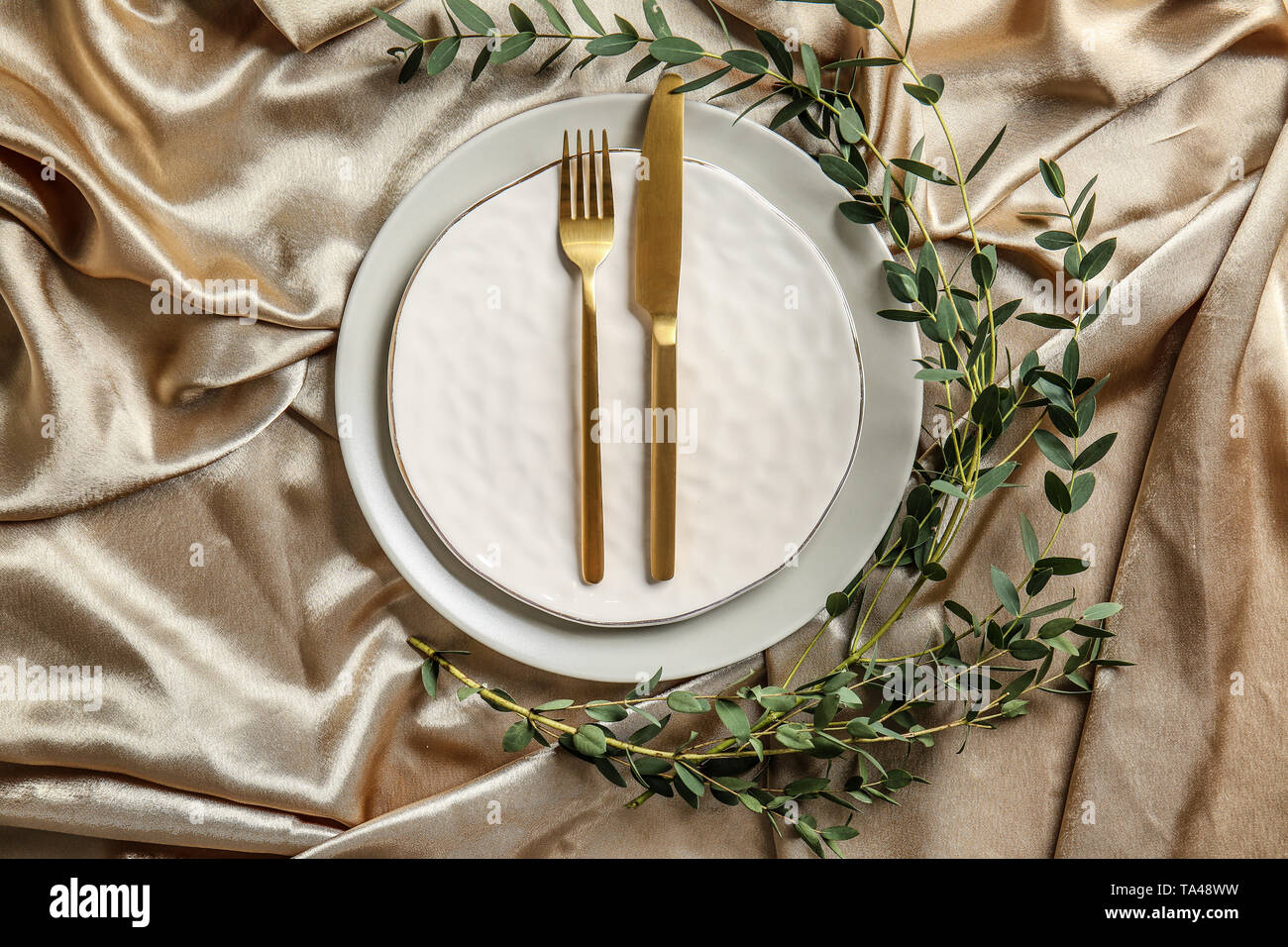 Simple table setting on color fabric Stock Photo - Alamy