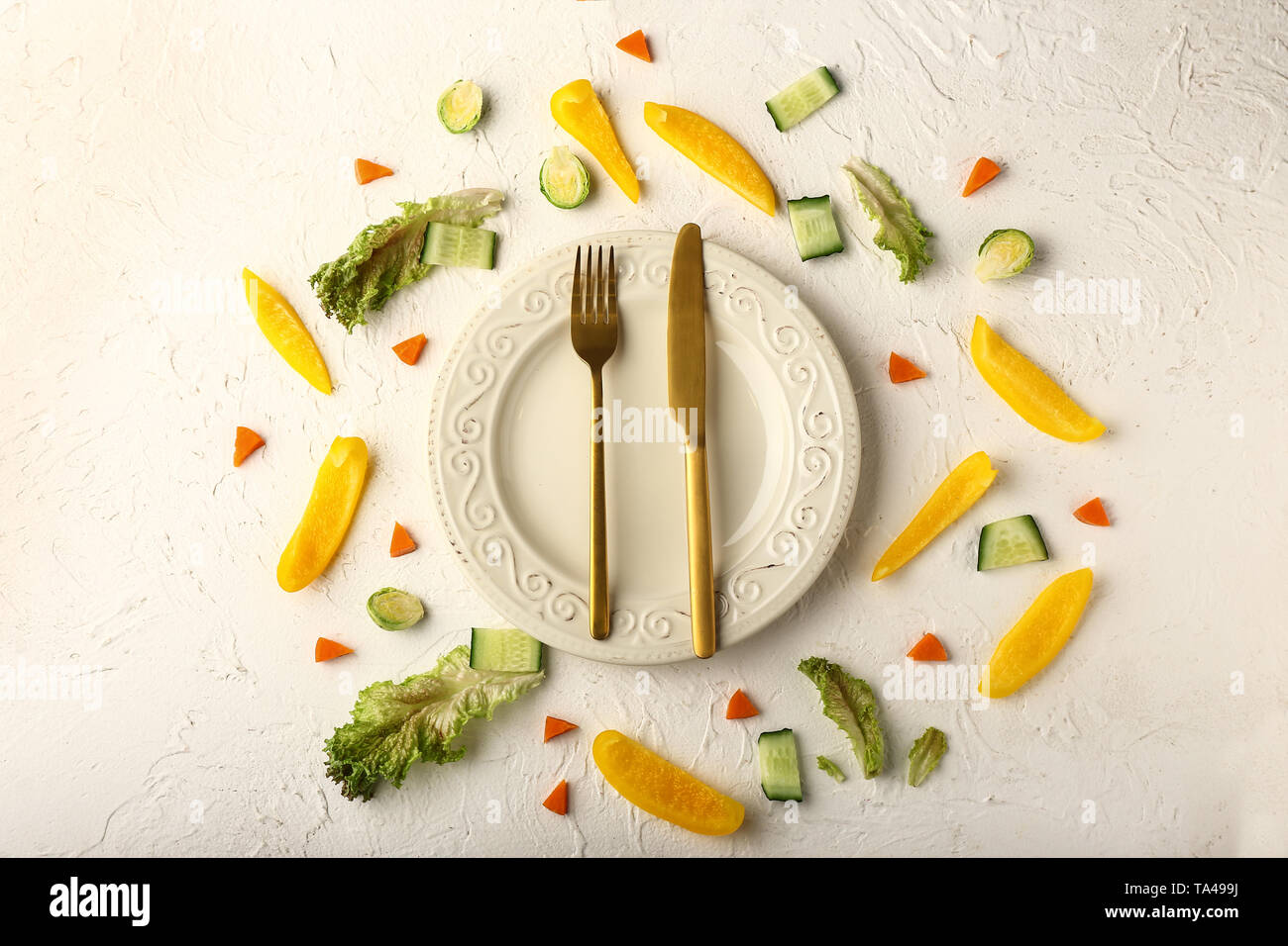 Beautiful table setting and many vegetables on white background Stock ...