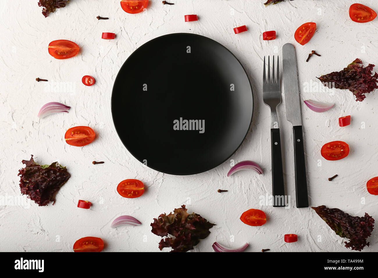 Beautiful table setting and many vegetables on white background Stock ...