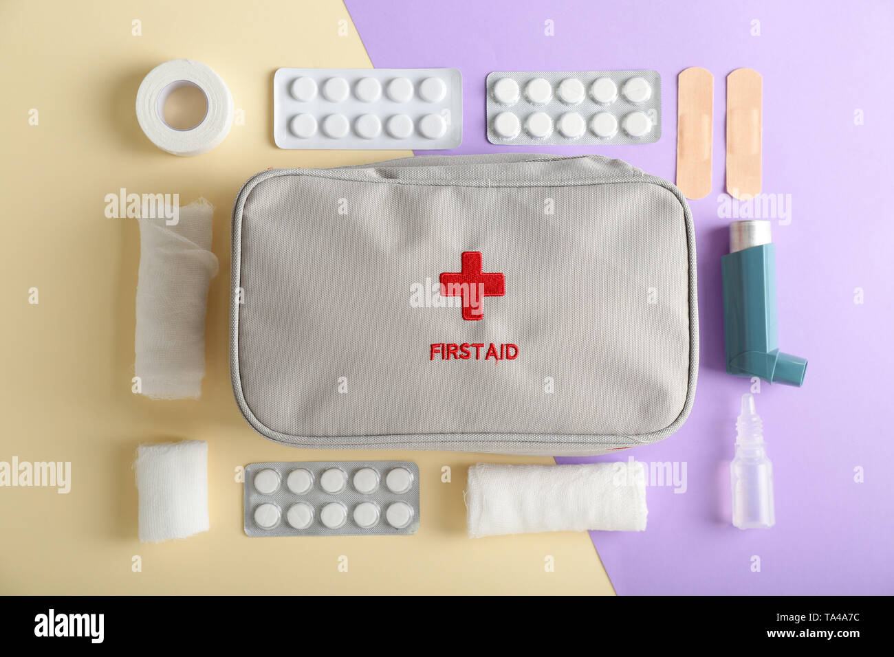 First aid kit on color background Stock Photo - Alamy