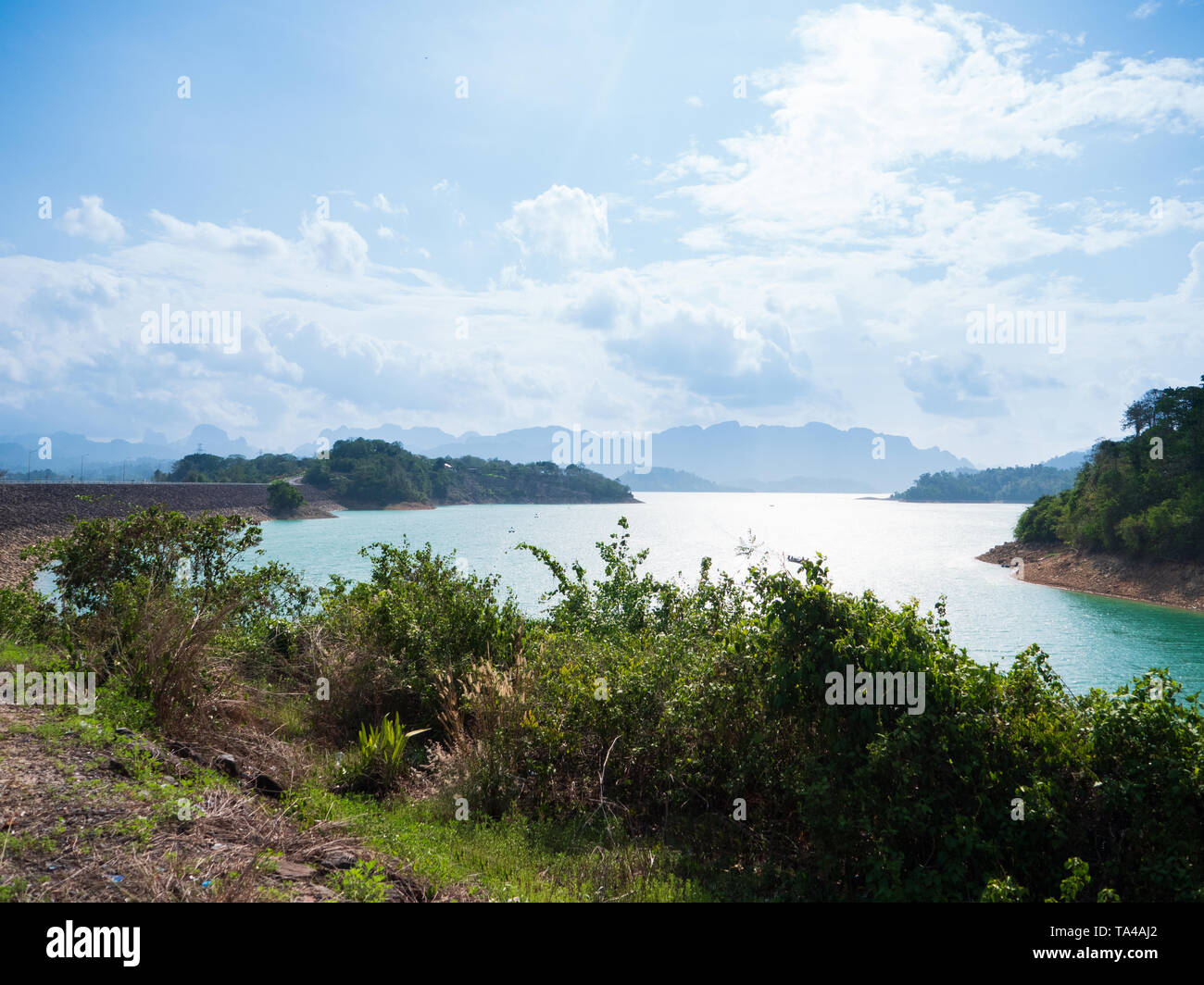 Scenic landscape of big river and reservoir dam with mountain and ...