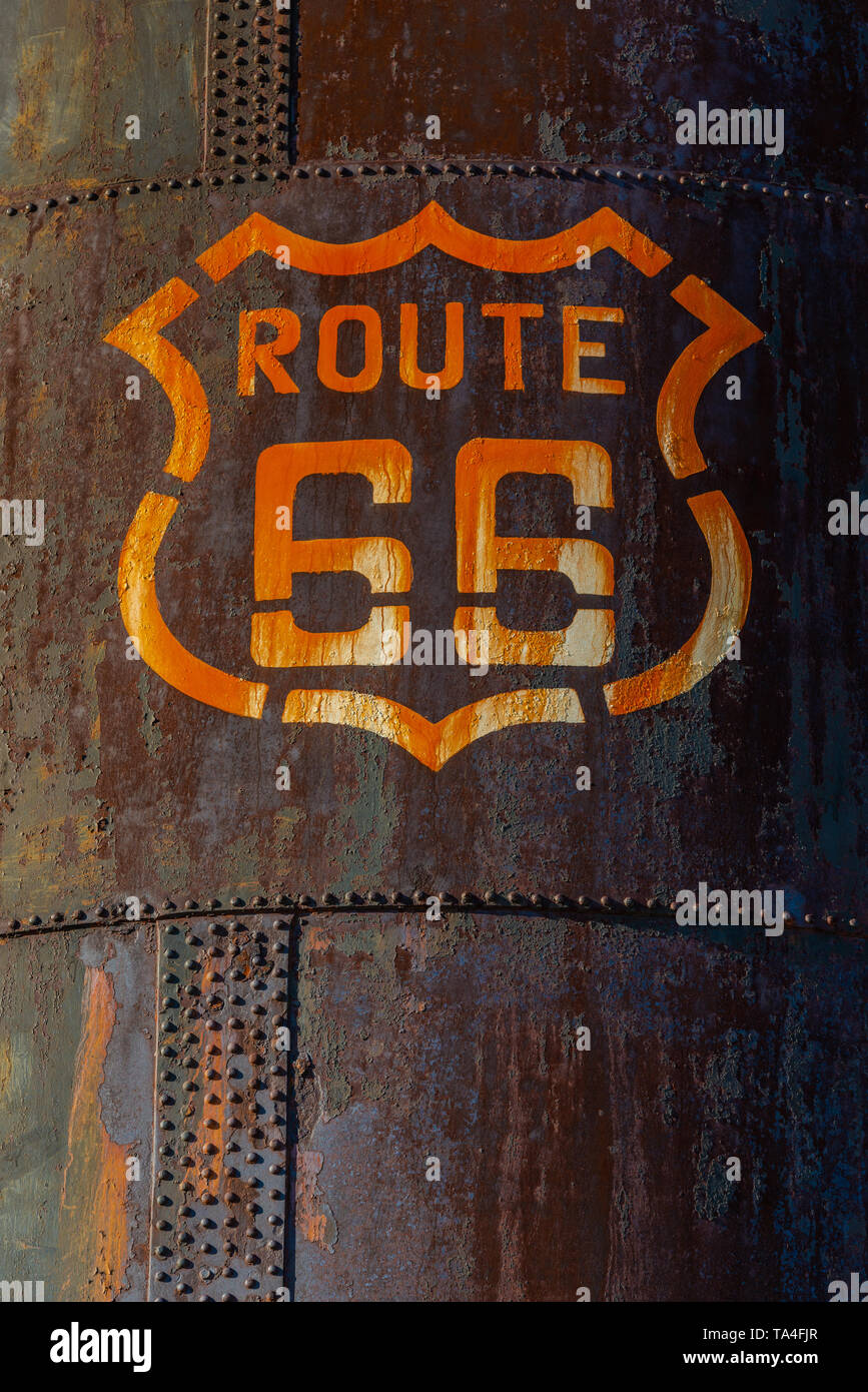The Route 66 highway marker painted on the side of a rusty tank Stock ...