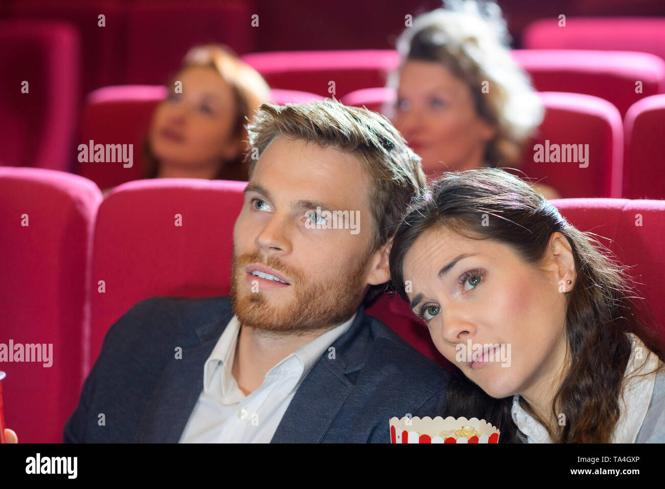 happy romantic couples in movie theater Stock Photo - Alamy