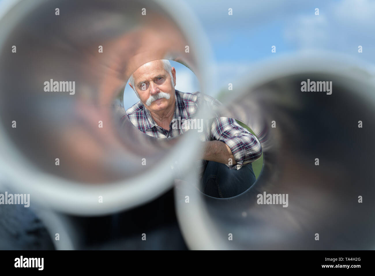 Construction looking through pipe hi-res stock photography and images ...