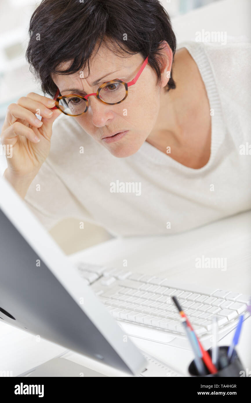 photo of woman checks a pc problem Stock Photo - Alamy
