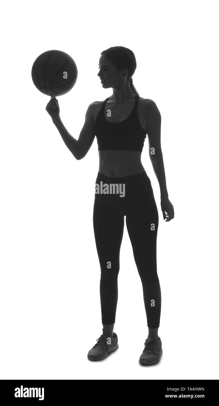 Portrait of beautiful woman playing basketball on white background ...